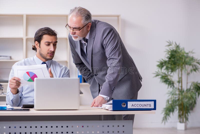 Two Accountants Working in the Office Stock Photo - Image of accountant ...