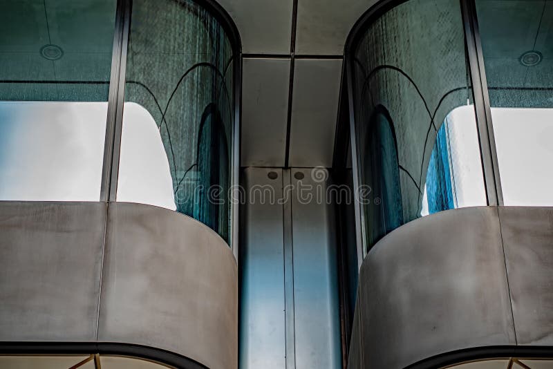 Two Large Windows Next To Each Other Outside of a Building Stock ...