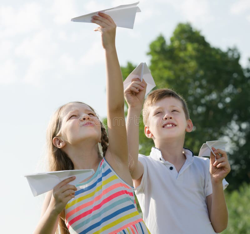 Two Admiring Kids Playing with Simple Paper Planes Stock Photo - Image ...