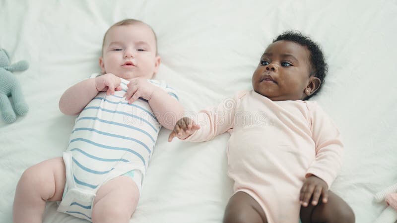 Two Adorable Babies Lying on Bed at Bedroom Stock Image - Image of ...