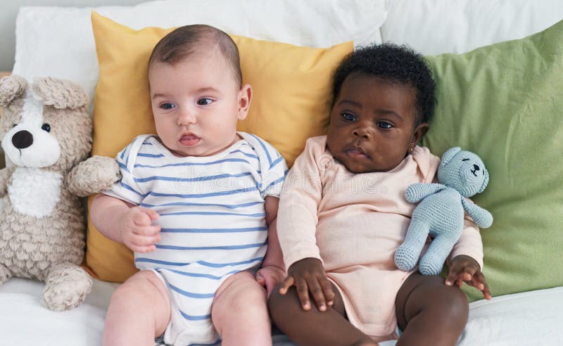 Two Adorable Babies Sitting on Bed at Bedroom Stock Image - Image of ...
