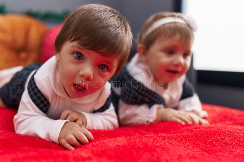 Two Adorable Babies Smiling Confident Lying on Sofa at Home Stock Image ...