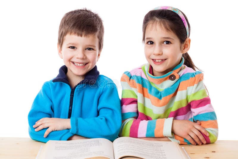 Two kids reading the book stock image. Image of people - 24251265