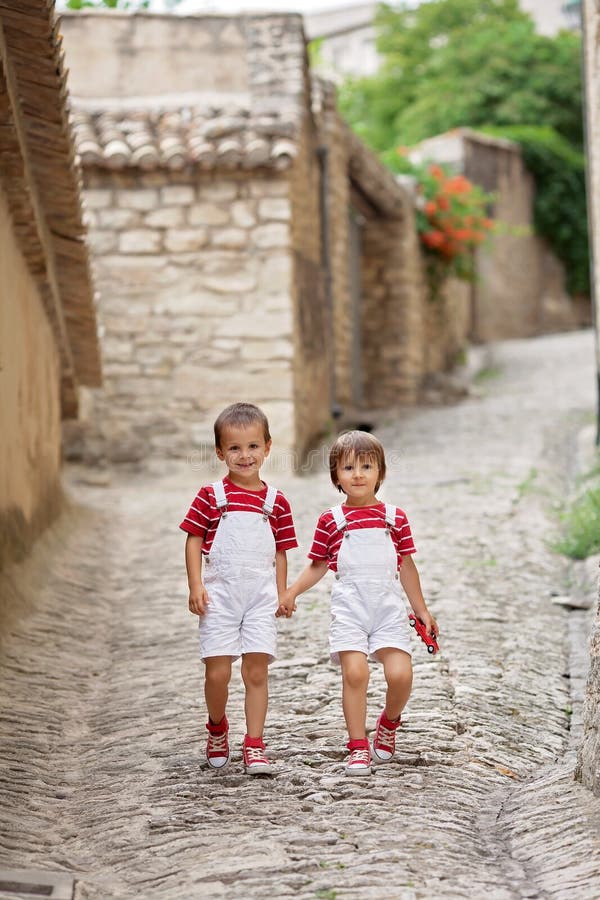 Two Adorable Kids, Walking on the Street, Smiling at Camera Stock Image ... Two Adorable Kids, Walking on the Street, Smiling at Camera Stock Image ...