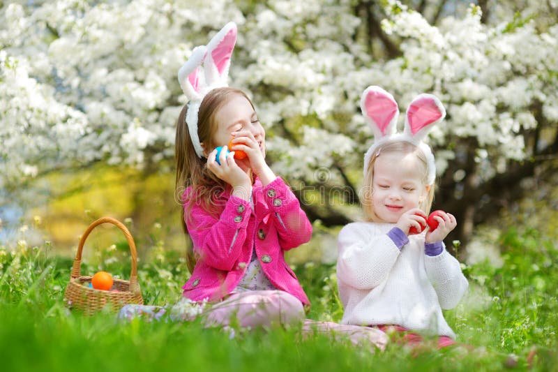 Two Adorable Little Sisters Playing with Easter Eggs on Easter Day ...