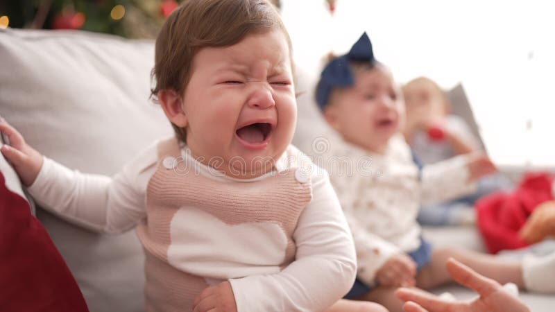 Two Adorable Toddlers Sitting on Sofa Crying at Home Stock Photo ...