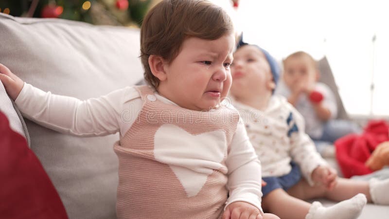 Two Adorable Toddlers Sitting on Sofa Crying at Home Stock Image ...