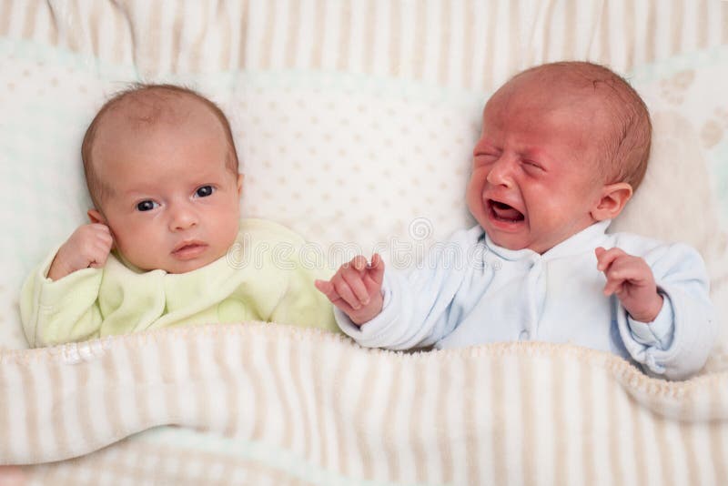 Two Adorable Twin Babies. One Looking, One Crying Stock Image - Image ...