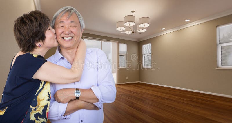 Two Affectionate Chinese Senior Adults in New Empty Room of House Stock ...