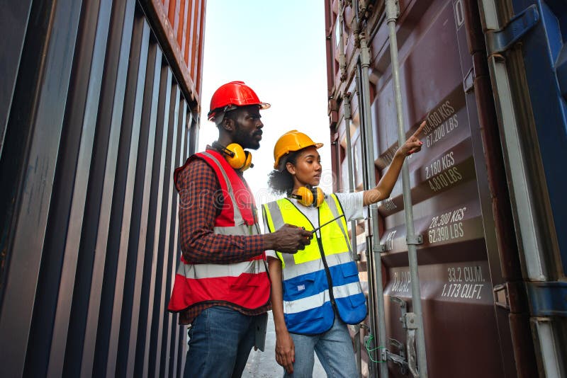 Two African American Male and Female Worker Check and Control Loading ...