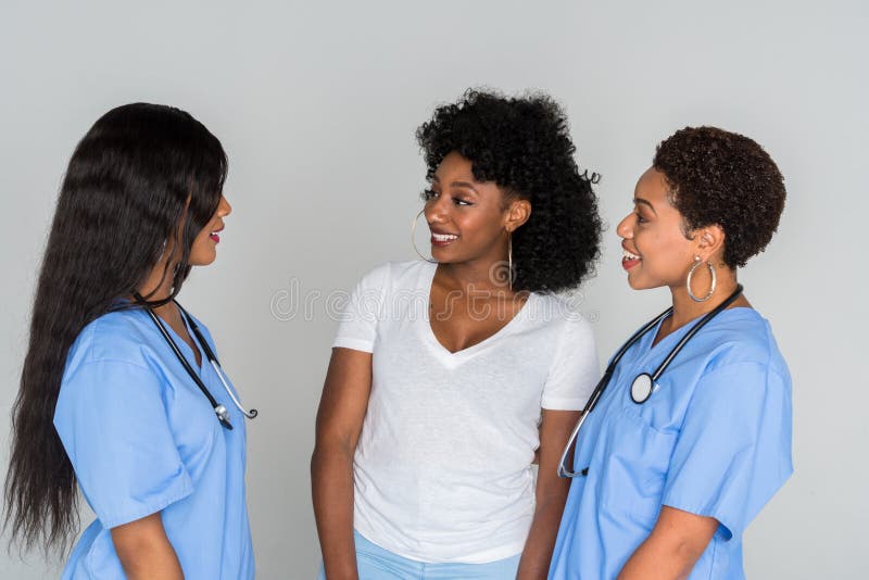 Two Nurses with Patient stock image. Image of women - 118882141