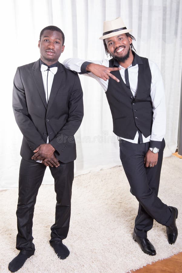 Two African Guys Posing on a Carpet Stock Photo - Image of couch, side ...