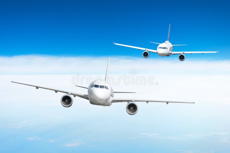 Two Airplanes Fly One by One Over the Clouds. Stock Photo - Image of ...