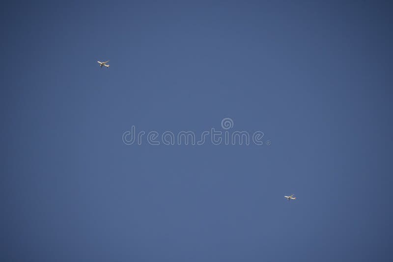 Two Airplanes Flying in the Blue Sky Stock Photo - Image of flight ...