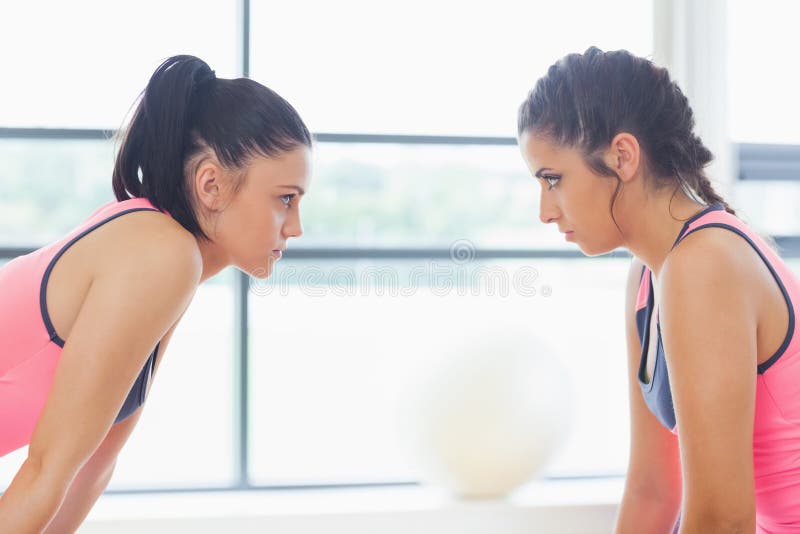 Two Angry Women Staring at Each Other at a Gym Stock Photo - Image of ...