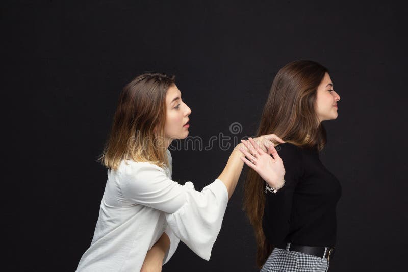 Two Angry Young Women Discussing a Black Background - Concept of Anger ...