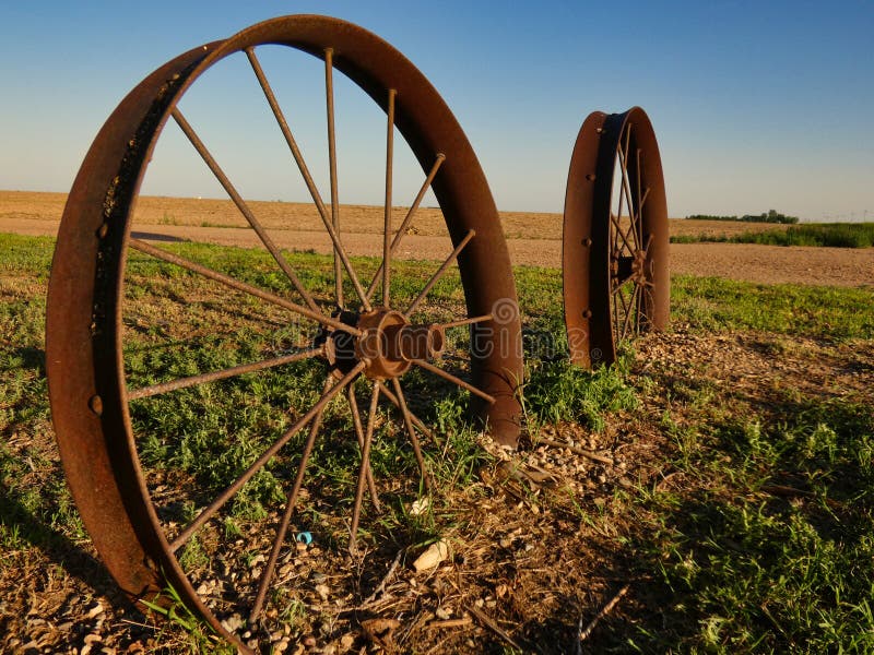 Two Antique Wagon Wheels in the Warm Sunlight Stock Image - Image of ...