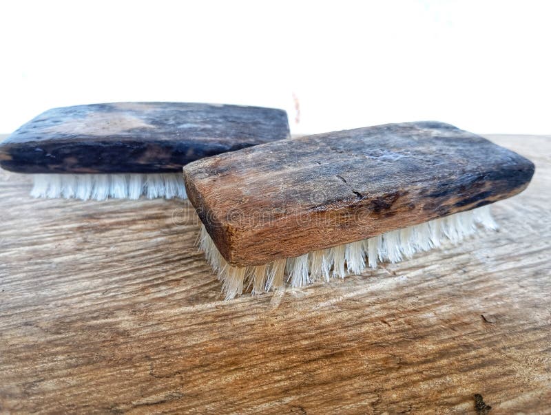 Two Antique Wooden Shoe Brushes with Worn Bristles, Resting on a Rustic ...