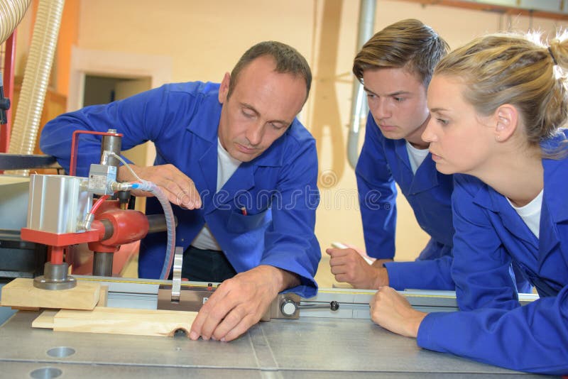 Two Apprentices Having Carpentry Lesson Stock Image - Image of ...