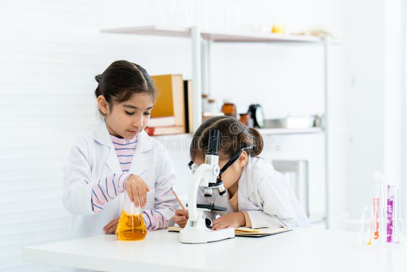Two Arab Schoolgirls are Having Fun Learning Science by Practicing with ...