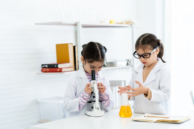 Two Arab Schoolgirls are Having Fun Learning Science by Practicing with ...