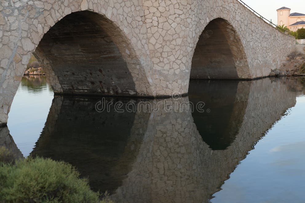 Two-arch Bridge Over the River with Reflection in the Water I Stock ...