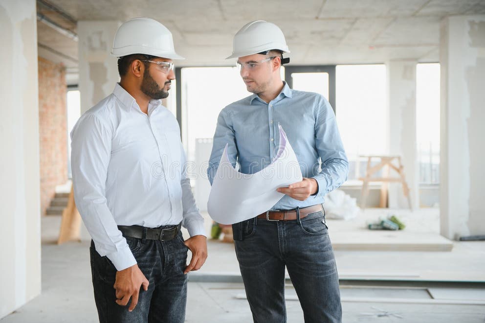 Two Architect Engineers are Walking in a Constructed Office Building ...