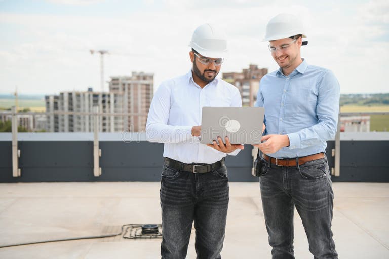 Two Architect Engineers are Walking in a Constructed Office Building ...