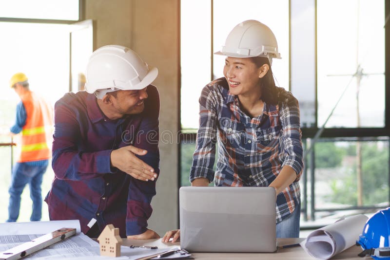 Two Architect Look at Blueprint and Planning To Renovation Room Stock ...