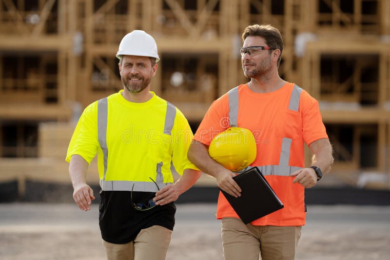Two Architect Men Have Construction Project on Clipboard. Photo of ...
