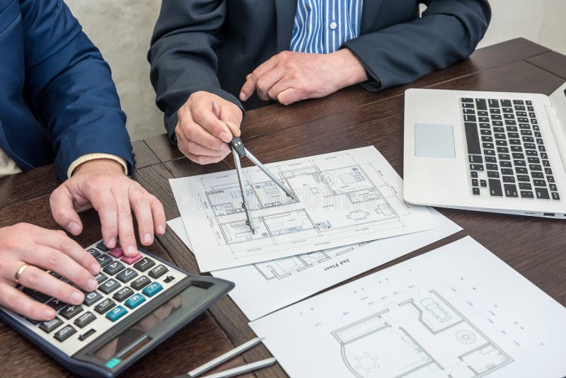 Two Architect Partners Working at Houme Draw Construction with Laptop ...