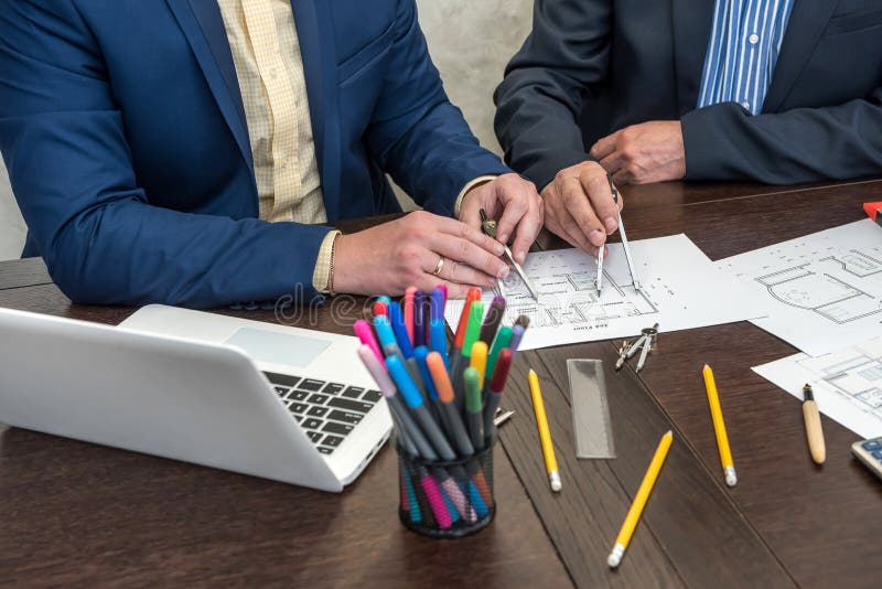 Two Architect Partners Working at Houme Draw Construction with Laptop ...