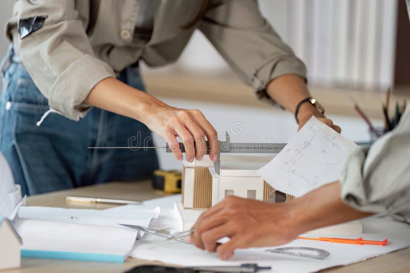 Architectural Design Collaboration. Professionals Working on a Building ...