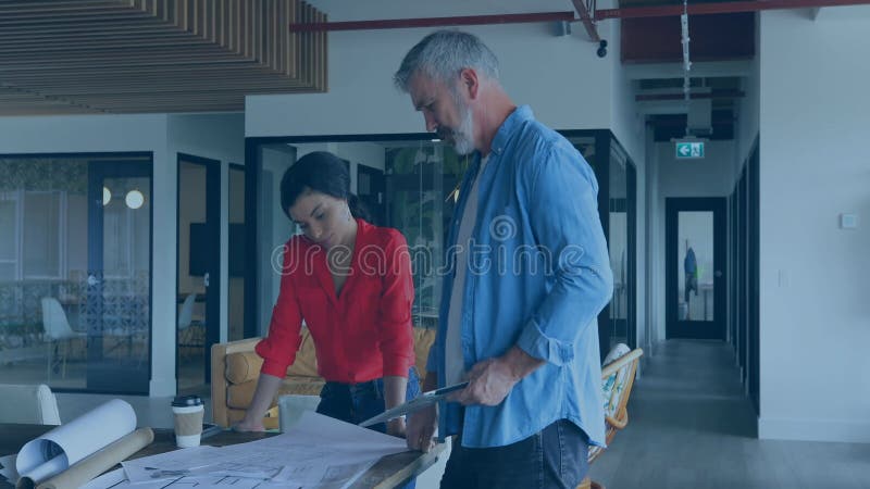 Two Architects are Collaborating Over Plans in Flat Architecture Office ...