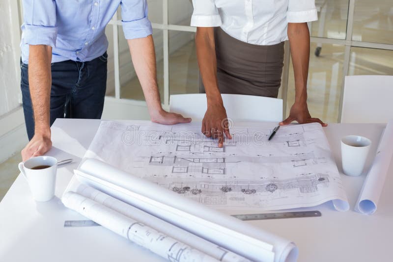 Two Architects Looking at Blueprints Stock Image - Image of people ...