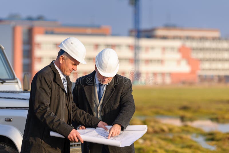 Two Architects Man Look at Construction Plan Stock Photo - Image of ...
