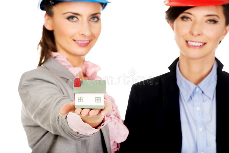 Two Architects Women with House Model. Stock Photo - Image of ...