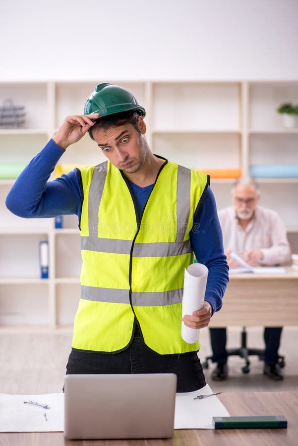 Two Male Architects Working on the Project Stock Image - Image of tired ...
