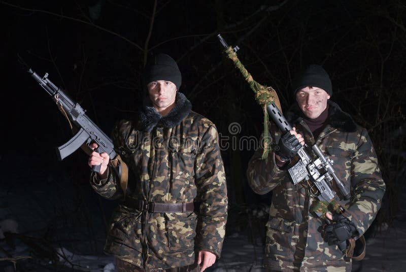 Two armed military men. stock image. Image of commando - 18495987