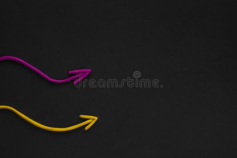 Two Arrows of Different Colors on Black Background, Shot from Above ...