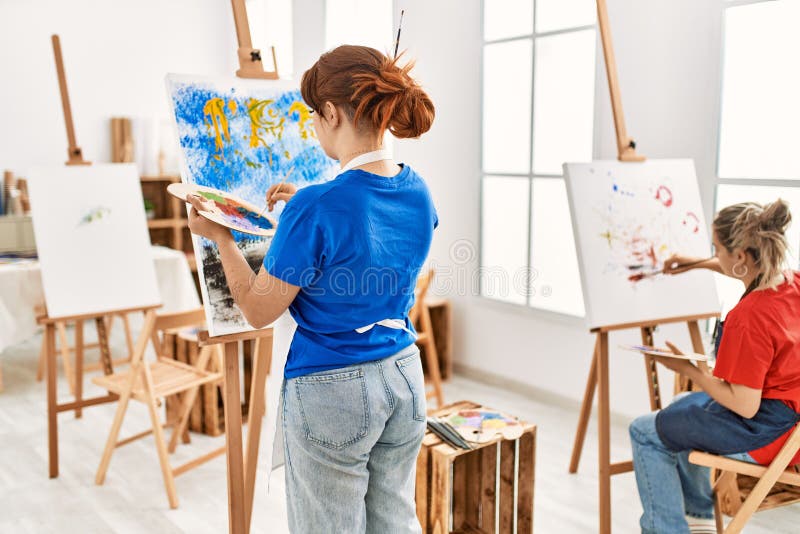 Two Artist Student Women on Back View Painting at Art School Stock ...
