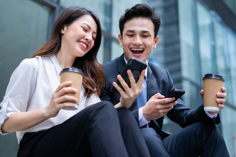 Two Asian Business People are Discussing Work during Recess Stock Image ...
