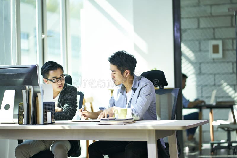 Two Asian Business People Working Together in Office Stock Image ...
