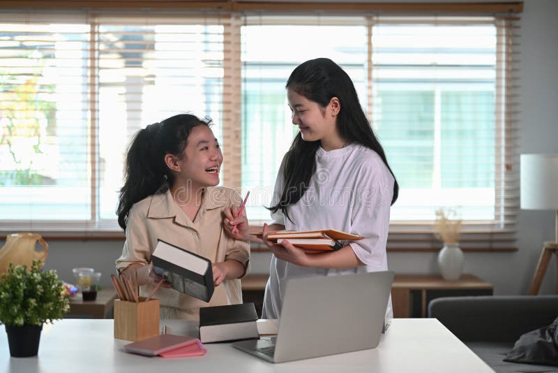 Two Children Doing Homework Together and Helping Each Other. Stock ...