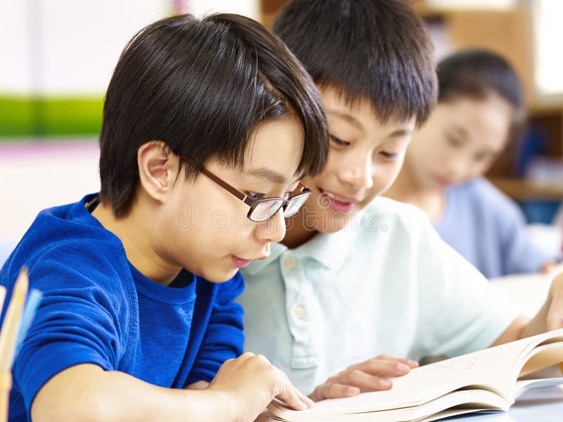 Two Asian Pupils Studying Together in Classroom Stock Photo - Image of ...