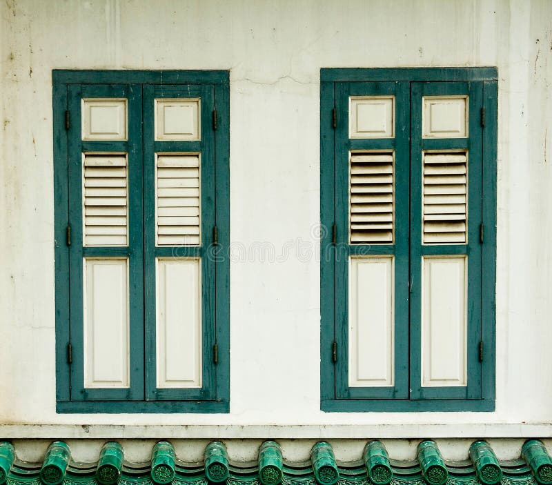 Two Asian Shop Windows with Green Frames and Shutters Stock Image ...