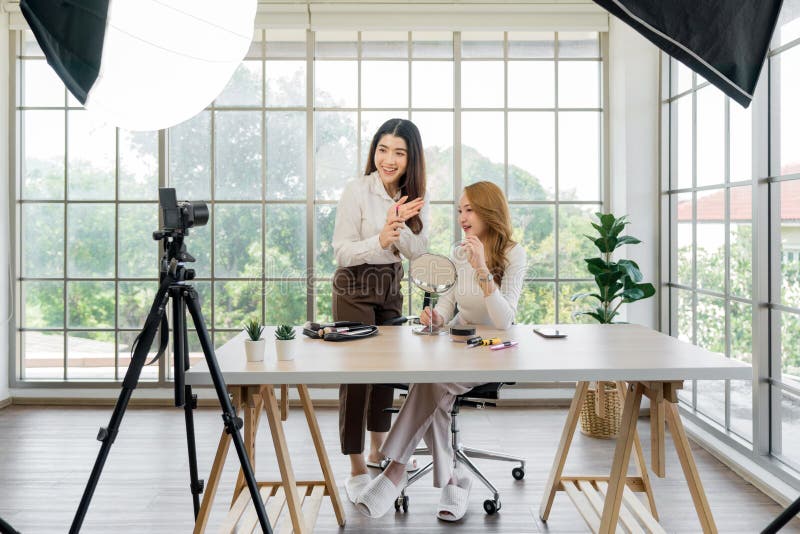 Two Asian Women Creating Content for Social Media. they are Using a ...