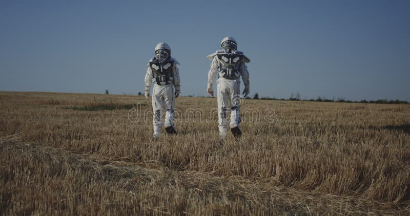 Two Astronauts Crossing a Field Stock Footage - Video of science, scifi ...