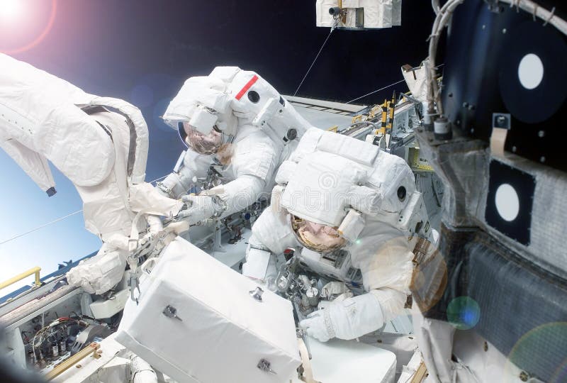 Two Astronauts are Engaged in Experiences and Repair at the Space ...