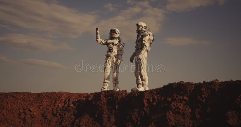 Two astronauts on Mars stock photo. Image of orientation - 153418752